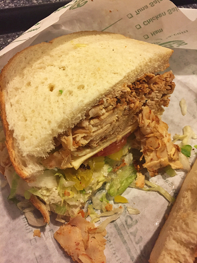 Chicken sandwich perfection – where every layer from the seasoned meat to the crisp vegetables plays its part in the flavor orchestra.