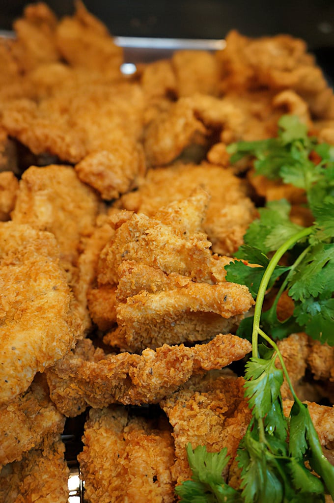 Golden-fried chicken tenders that crunch like autumn leaves, seasoned just right and waiting to be dunked in your sauce of choice.