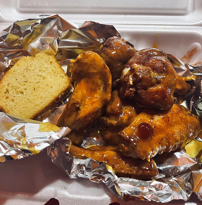 Barbecued chicken wings that make you question why anyone would ever bread and fry these beautiful appendages. The sauce glistens with promise.