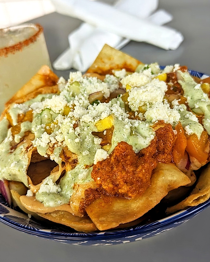 The legendary chili nachos&mdash;where every chip bears the perfect ratio of toppings. No sad, naked chips hiding at the bottom of this masterpiece.