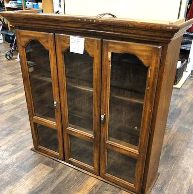 This china cabinet isn't just furniture; it's waiting to display your grandmother's teacups or that quirky collection you've been hiding in boxes.