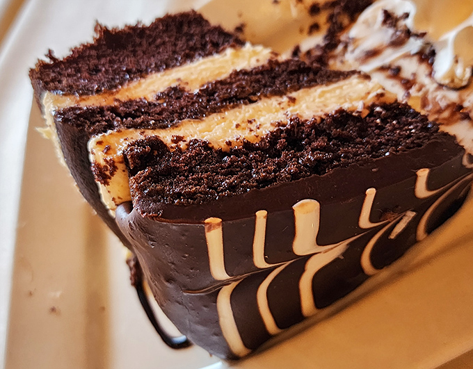 Chocolate cake so decadent it should come with its own warning label. Those layers aren't just dessert—they're therapy on a plate.