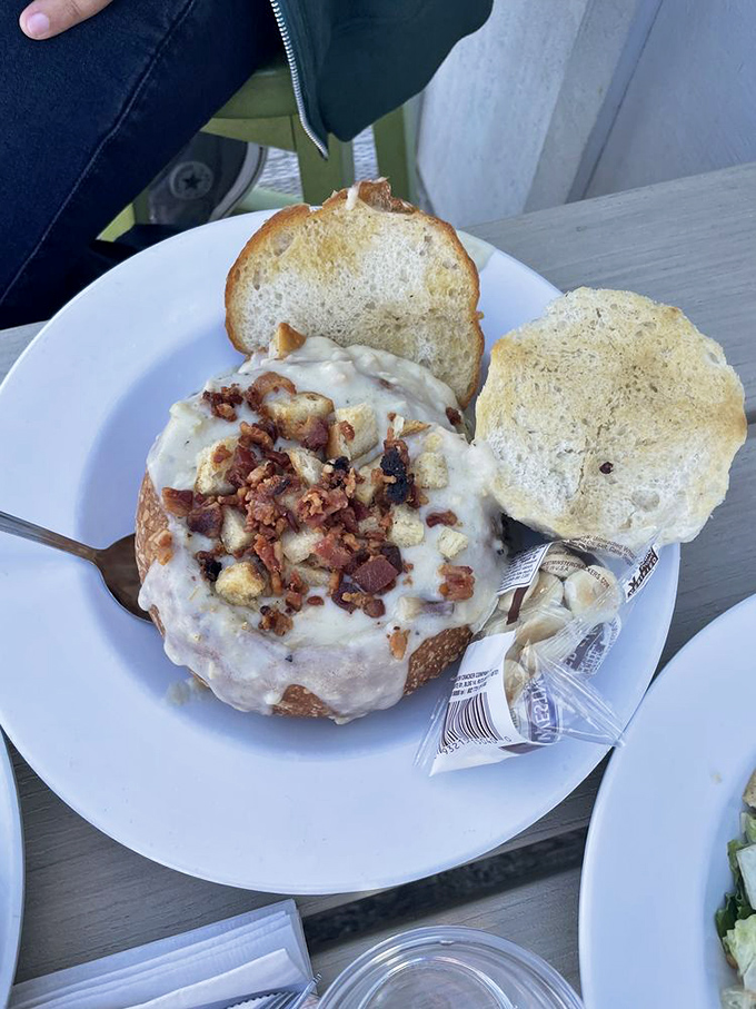 Not just any bread bowl, but a sourdough throne worthy of the creamy clam chowder kingdom it cradles, complete with bacon confetti.