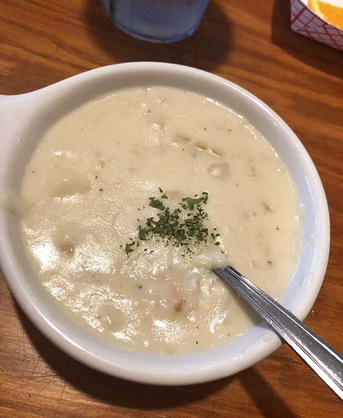 This isn't just clam chowder; it's a creamy hug in a bowl, warming souls one spoonful at a time.