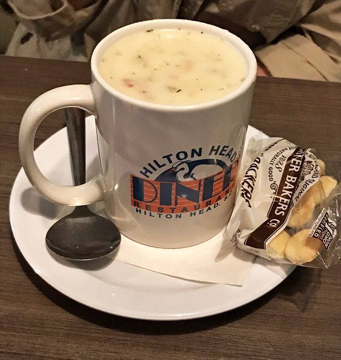 A mug of clam chowder that could make a New Englander weep with joy, served with crackers for that essential textural contrast.