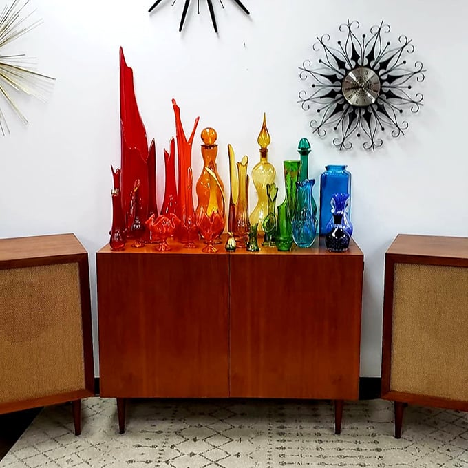 A rainbow of vintage glass that catches light like liquid jewels. Mid-century modern at its most gloriously colorful.