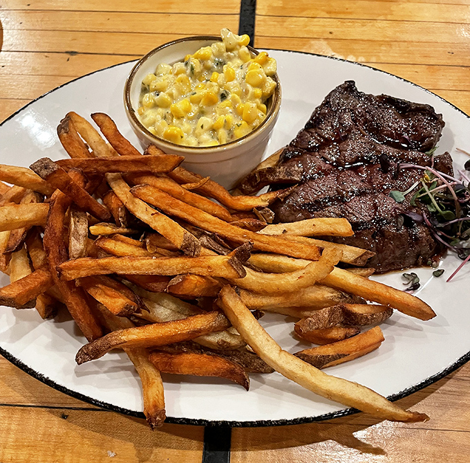The holy trinity of comfort: hand-cut fries, creamy corn, and a steak that makes you question why you ever eat anywhere else.