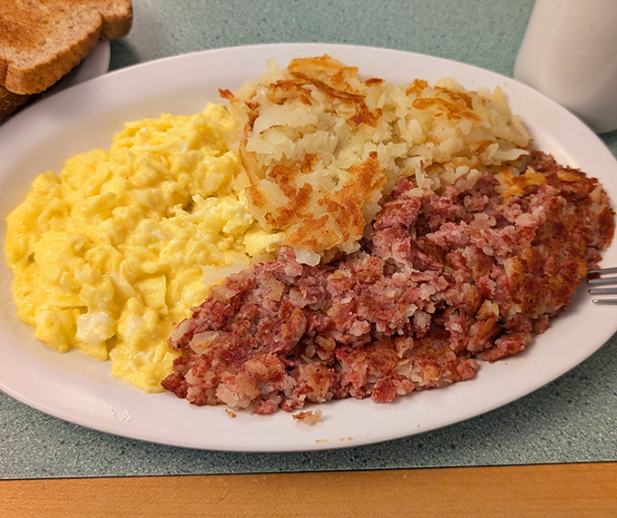 Corned beef hash that's actually corned beef, not mystery meat confetti. With those scrambled eggs and crispy potatoes, it's the breakfast trifecta.