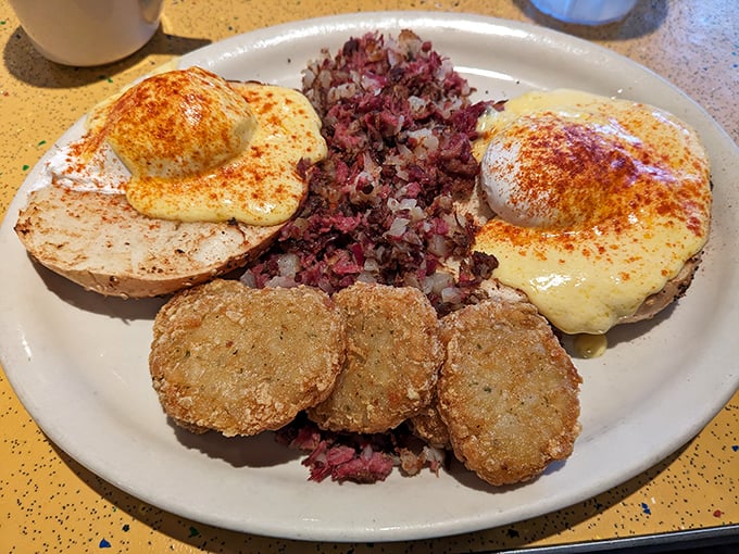 Corned beef hash crowned with eggs Benedict&mdash;proof that breakfast can be both a comfort and an adventure.