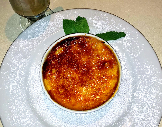 That caramelized top crackles like autumn leaves, hiding creamy custard dreams beneath its golden surface.