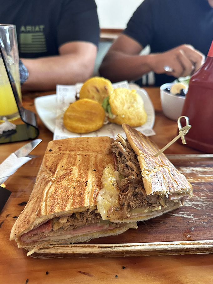 The Cuban sandwich that launched a thousand debates. Perfectly pressed, gloriously layered, and served with what appears to be tostones&mdash;this is Florida on a plate.