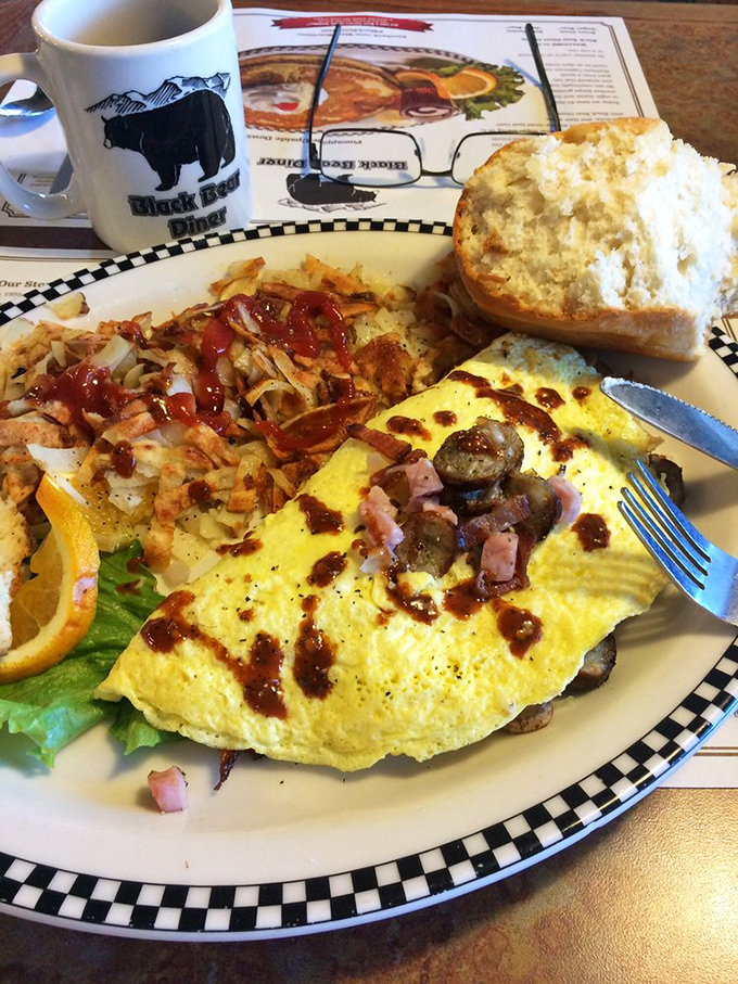Breakfast alchemy at its finest—an omelet that transforms simple ingredients into morning gold, with hash browns that deserve their own fan club.