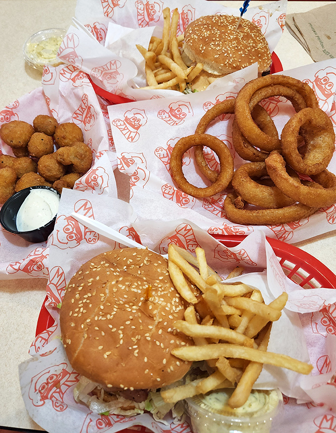 A feast fit for a family—golden onion rings, crispy tater tots, and perfect burgers create an edible tableau of American classics.