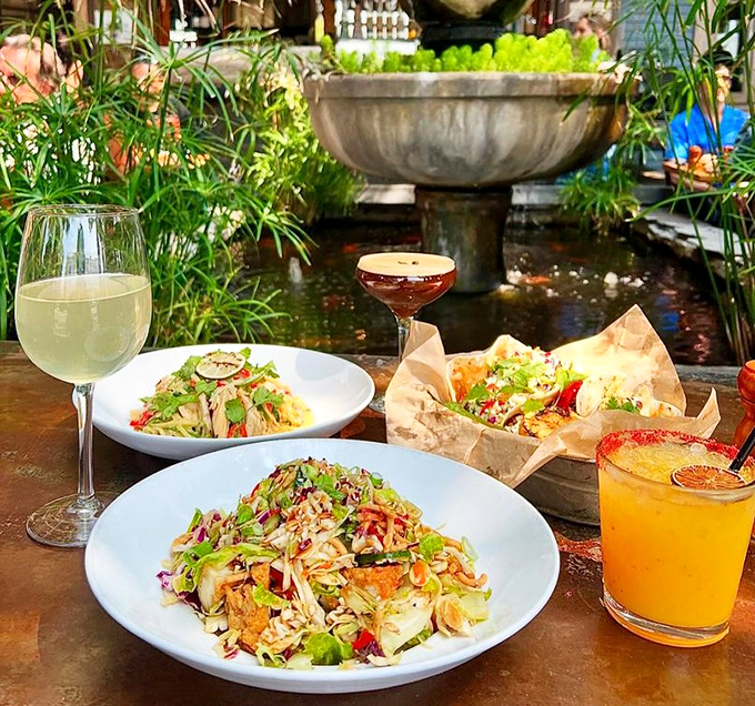 Garden-fresh salads and colorful cocktails served alongside a tranquil fountain &ndash; like dining in your fantasy backyard that you'll never have to weed.