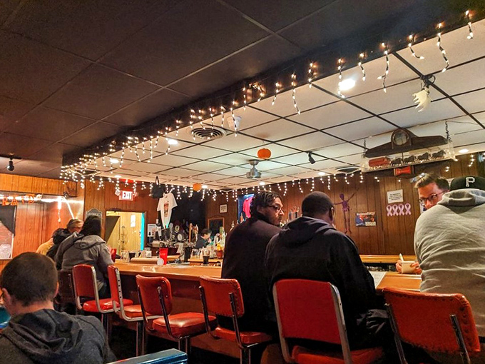 The bar at George's&mdash;where strangers become friends and friends become family, all under the warm glow of string lights. 