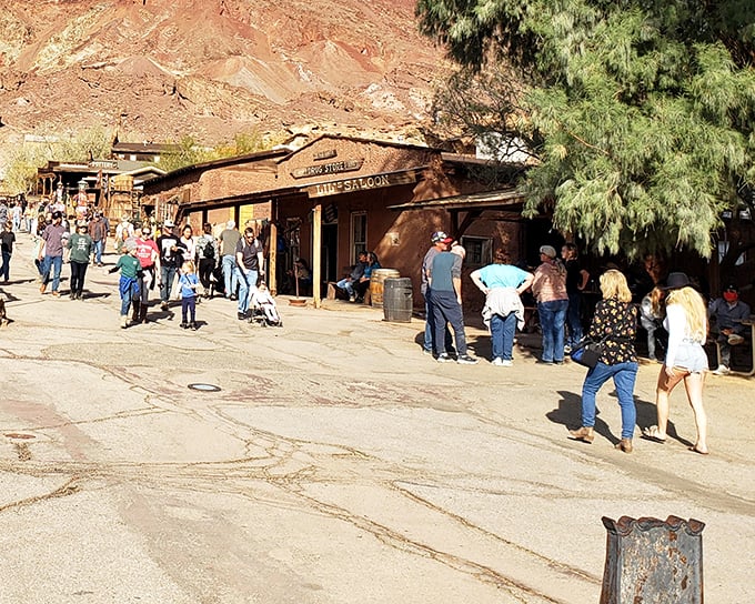 Visitors stroll past the saloon where miners once traded silver for liquid courage. Today's crowds seek Instagram gold rather than the mineral variety.