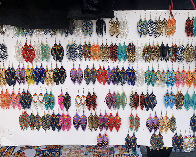 A hypnotic display of handcrafted earrings that would make Elizabeth Taylor pause mid-sentence&mdash;each pair telling its own colorful story.