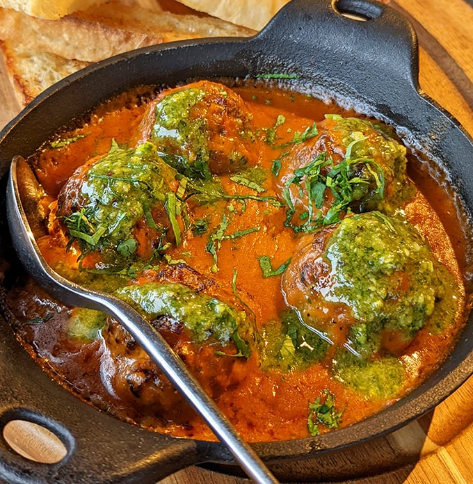 Eggplant meatballs swimming in Moroccan tomato sauce. Vegetarians get the last laugh with these flavor bombs that could convert even the most dedicated carnivore.