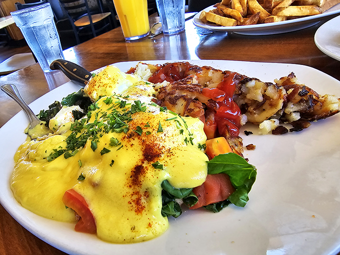Eggs Benedict that puts on a sunshine-yellow show, with hollandaise sauce cascading over fresh ingredients like a breakfast waterfall.