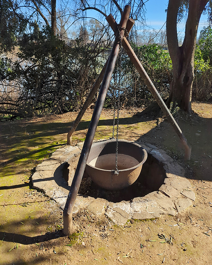 Cooking was a full-contact sport in pioneer days. This fire pit and hanging pot arrangement was the original slow cooker.