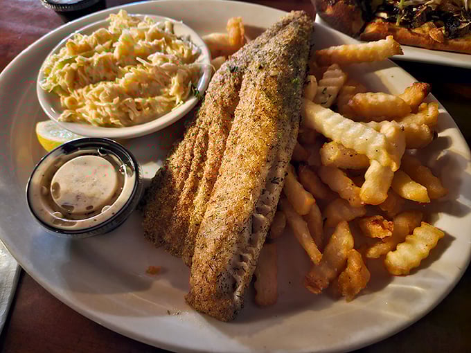 This fish fillet isn't just dinner&mdash;it's a golden-crusted masterpiece accompanied by the kind of fries that disappear one "just one more" at a time.