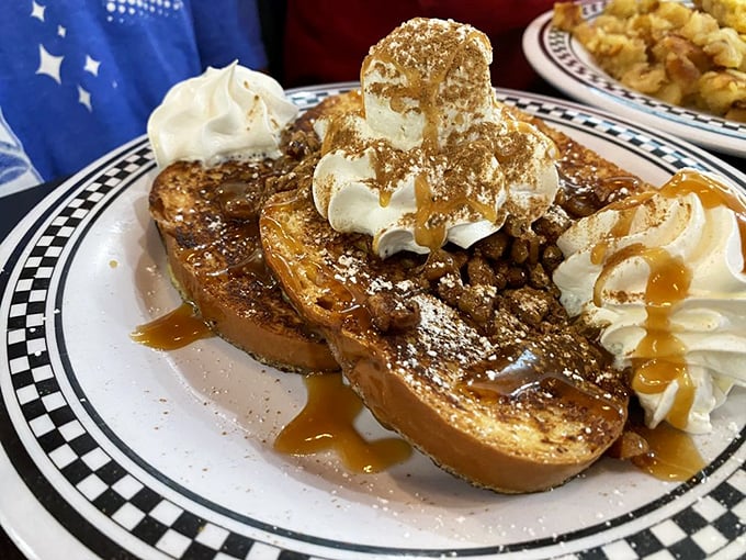 French toast that's having an identity crisis as a dessert &ndash; topped with whipped cream, caramel, and enough decadence to require a post-meal confession.