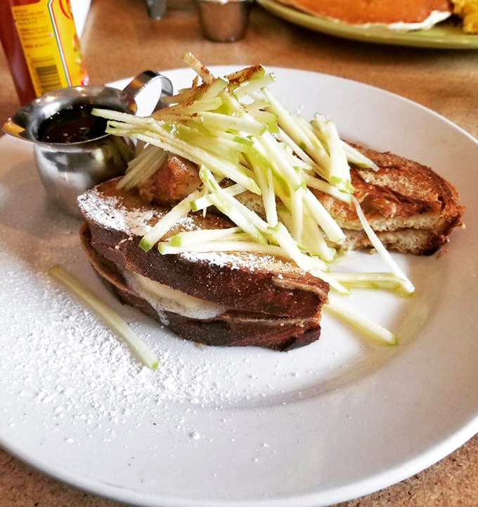 French toast that's dressed for success with apple slivers and a dusting of powdered sugar. Breakfast formal wear at its finest.