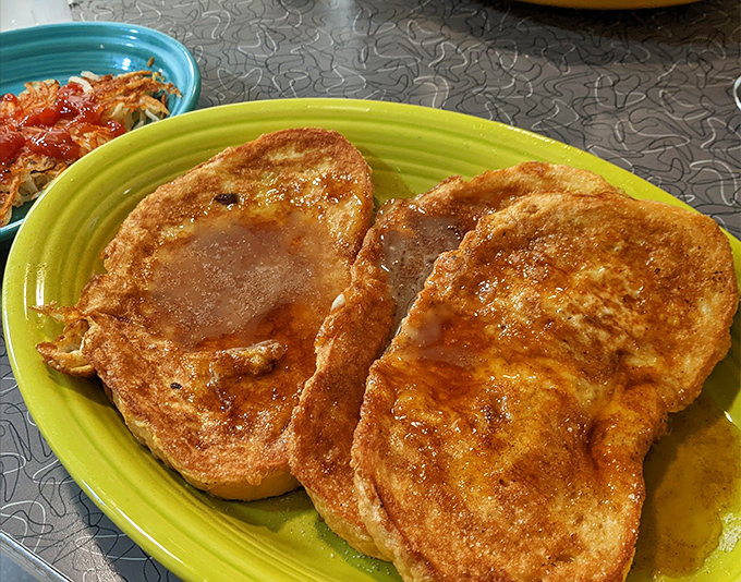 French toast that's achieved that mythical balance: crispy edges, custardy centers, and just waiting for a maple syrup baptism.