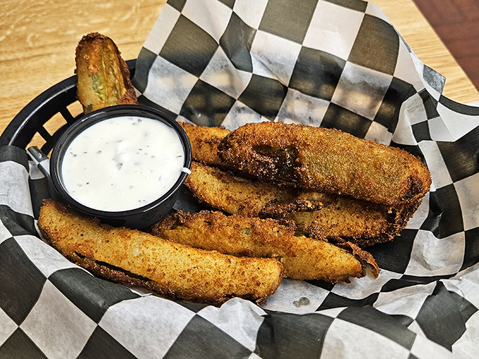 Fried pickles: proof that anything becomes exponentially better when battered and introduced to hot oil. The ranch dip is just showing off.