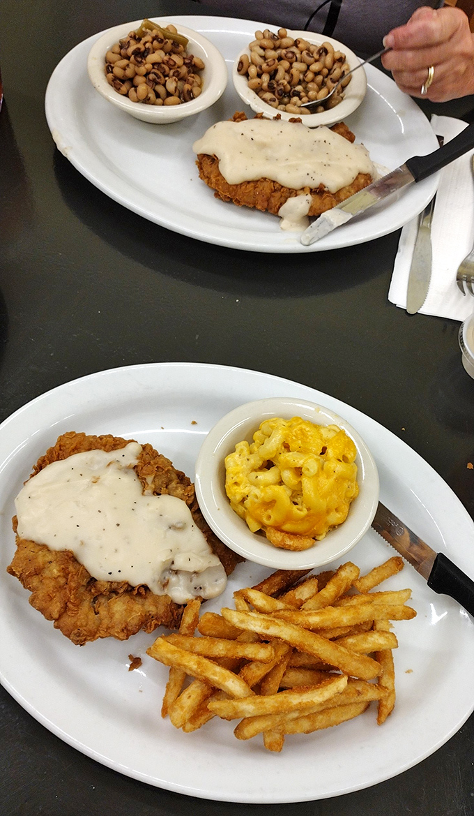 Country fried steak with gravy, mac and cheese, and crispy fries &ndash; the triumvirate of comfort food that makes cardiologists wince and taste buds sing hallelujah.