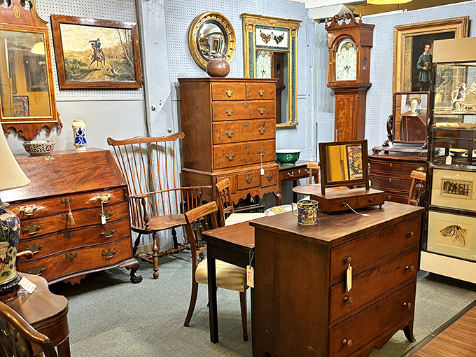 A furniture arrangement that screams "colonial chic meets New England practical." That Windsor chair has hosted more distinguished bottoms than a congressional hearing.