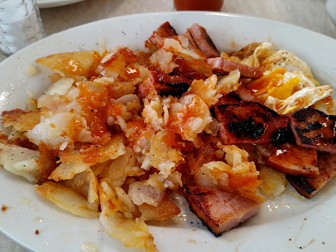 This breakfast hash with ham and eggs looks like what your grandmother would make if she secretly trained at a diner for 40 years.
