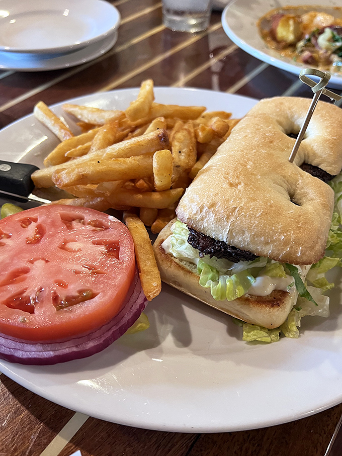 This sandwich isn't just lunch&mdash;it's an architectural achievement. Crisp fries, garden-fresh toppings, and that perfectly toasted bun create the Taj Mahal of midday meals.