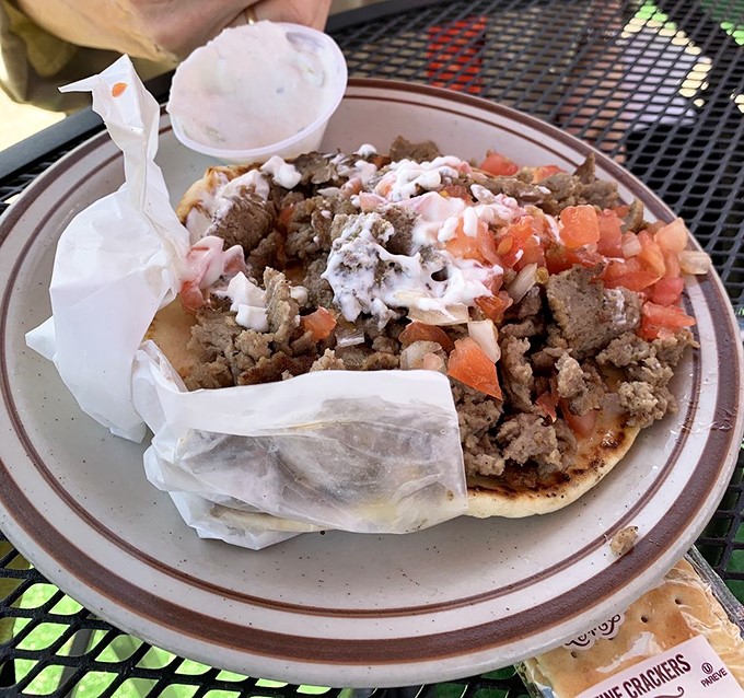 The gyro—where Mediterranean meets Mile High. Fresh veggies, seasoned meat, and tzatziki create a handheld vacation that doesn't require altitude adjustment.