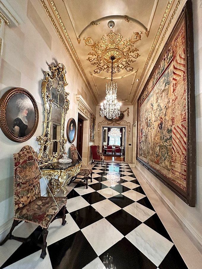 Walking this hallway feels like strolling through history with better lighting. The chandelier alone has probably witnessed more interesting conversations than most people.