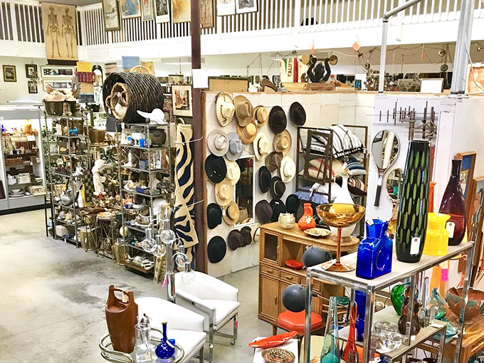 The wall of vintage hats isn't just fashion; it's time travel hanging on pegs, each one waiting to crown a new adventure.