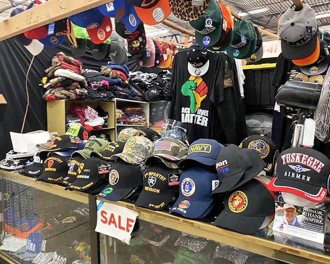 Military and specialty caps lined up like soldiers at attention. Headwear that tells stories without saying a word.