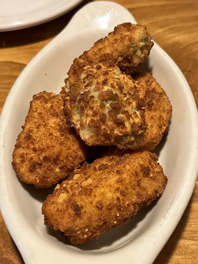 These golden-brown corn fritters aren't just appetizers &ndash; they're little orbs of cornmeal joy that make waiting for your entr&eacute;e a pleasure, not a chore.