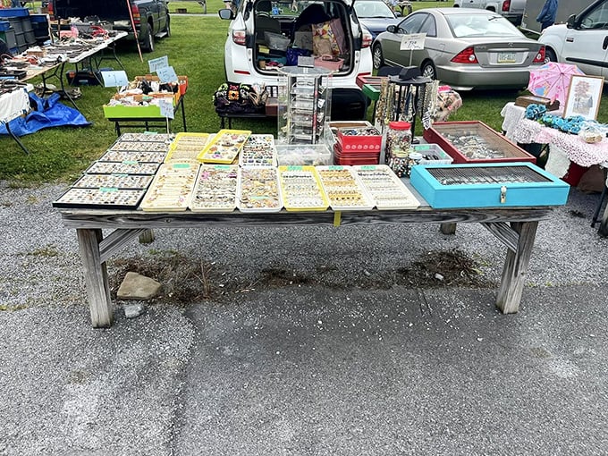 Jewelry displays transform ordinary tables into treasure maps. Each tray holds potential birthday gifts and impulse buys.