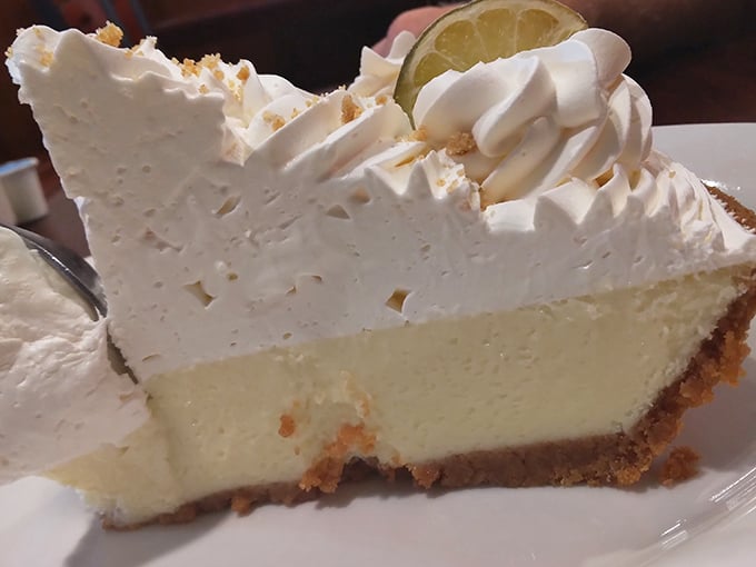 Key lime pie with a mountain of whipped cream&mdash;tangy, sweet, and tall enough to have its own zip code.