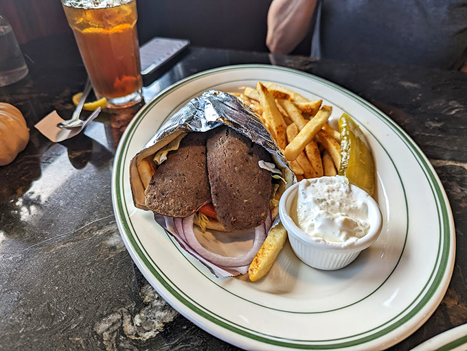 The gyro plate arrives like a Mediterranean vacation on china&mdash;crispy fries, cool tzatziki, and savory meat wrapped in warm pita.