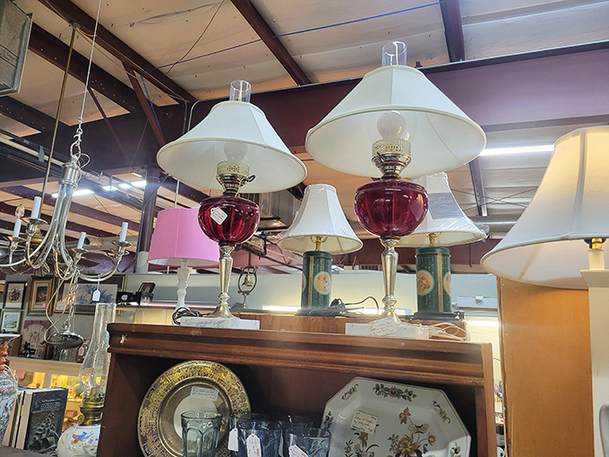 A forest of vintage lamps stands ready to illuminate your home with the warm glow of yesteryear. That cranberry glass base? Pure 1950s magic.