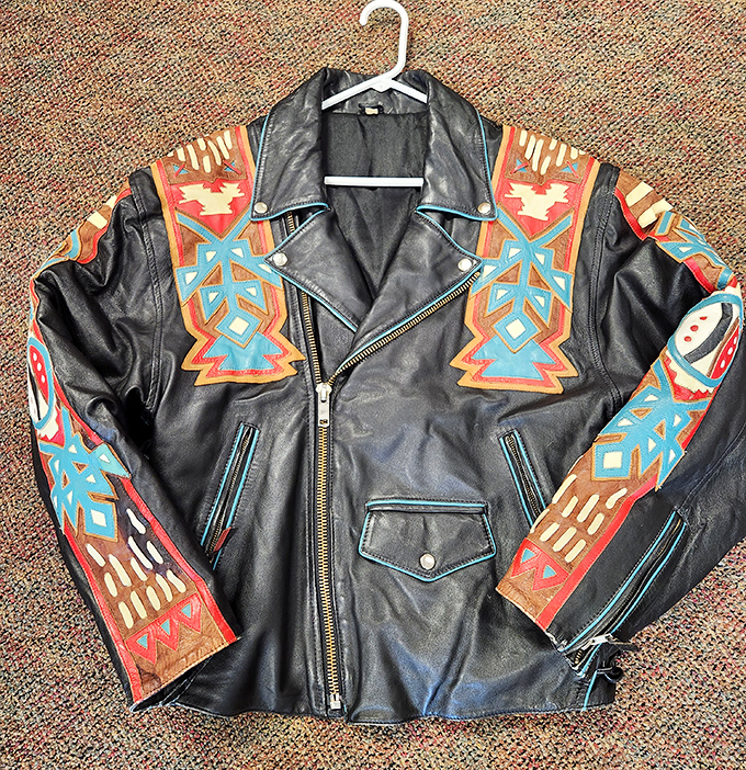 This southwestern-inspired leather jacket isn't just vintage clothing&mdash;it's wearable art with stories etched into every colorful geometric pattern.