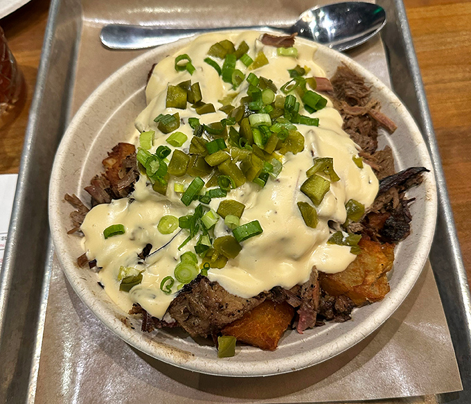 Loaded fried potatoes topped with brisket and cheese sauce&mdash;because sometimes your comfort food needs its own comfort food.