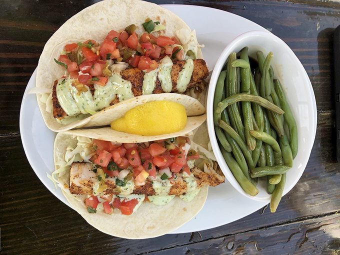 These fish tacos aren't just a meal, they're a beach vacation wrapped in a tortilla, complete with avocado cream vacation homes.
