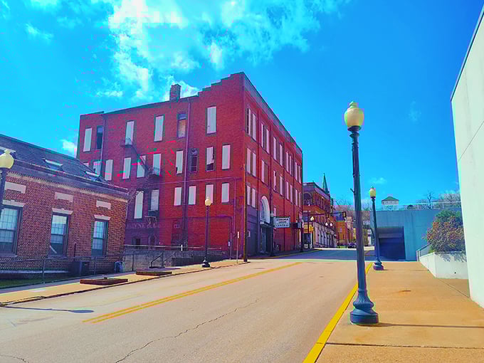 Donora's vibrant red brick buildings stand proudly against blue skies, like architectural veterans refusing to surrender to time's march.