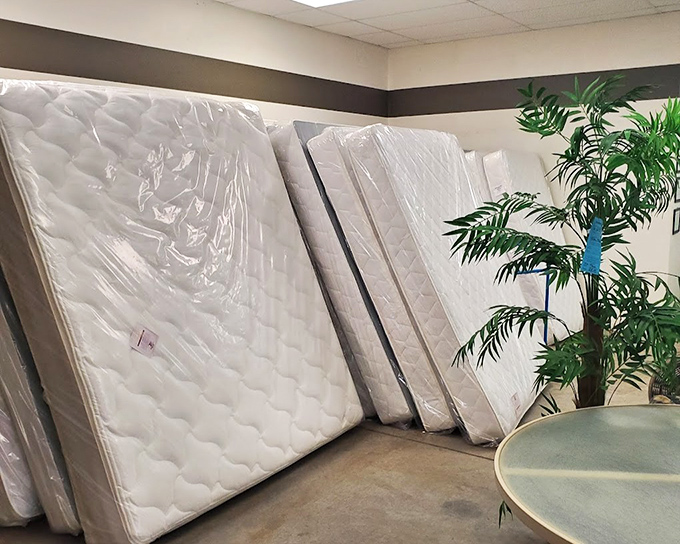 Mattress mountain! Nearly-new sleep surfaces stand at attention, offering desert dreamers a chance at better rest without the showroom sticker shock.