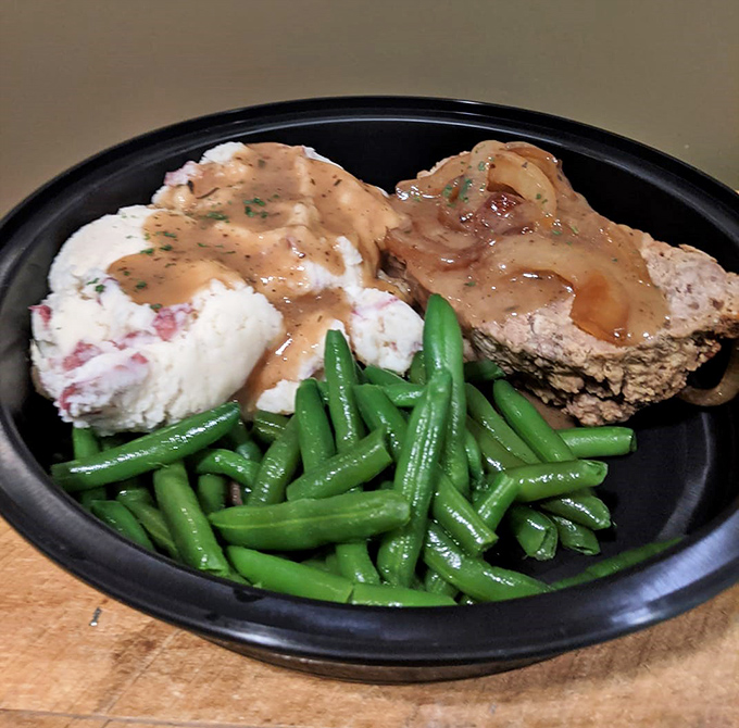 Meatloaf that would make your grandmother both proud and suspicious. Those green beans look fresh enough to have been picked this morning.
