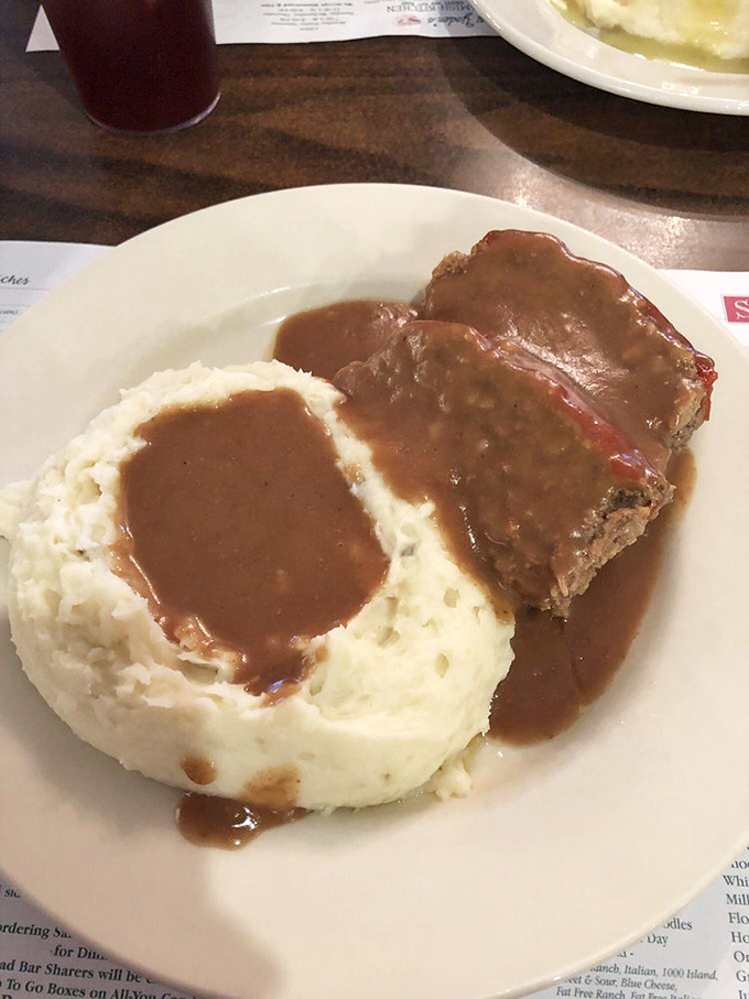 Meatloaf and mashed potatoes - the dynamic duo of comfort food. This plate has solved more problems than therapy.