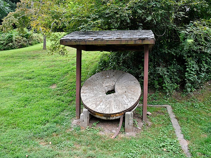 This millstone has seen more grain than most bakeries. Now retired from duty, it serves as a perfect conversation piece for history buffs.